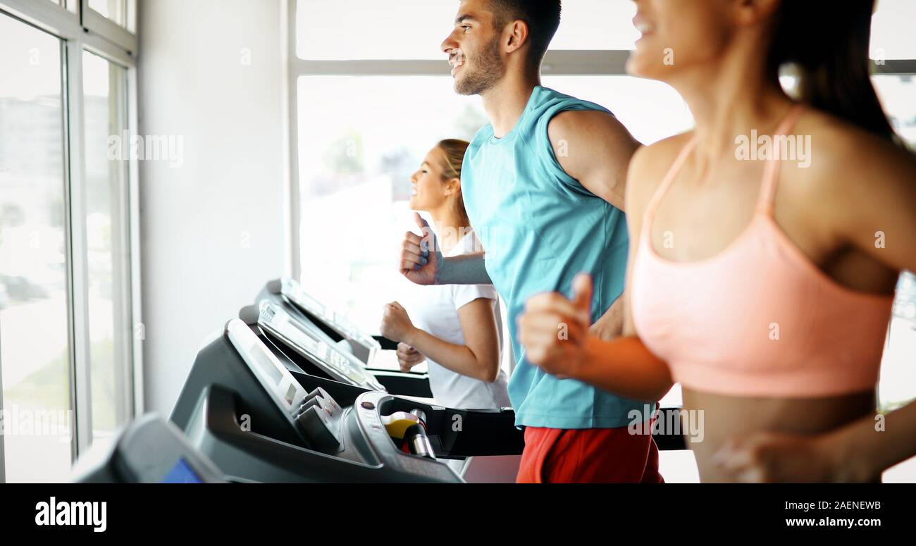 Picture of people running on treadmill in gym Stock Photo - Alamy