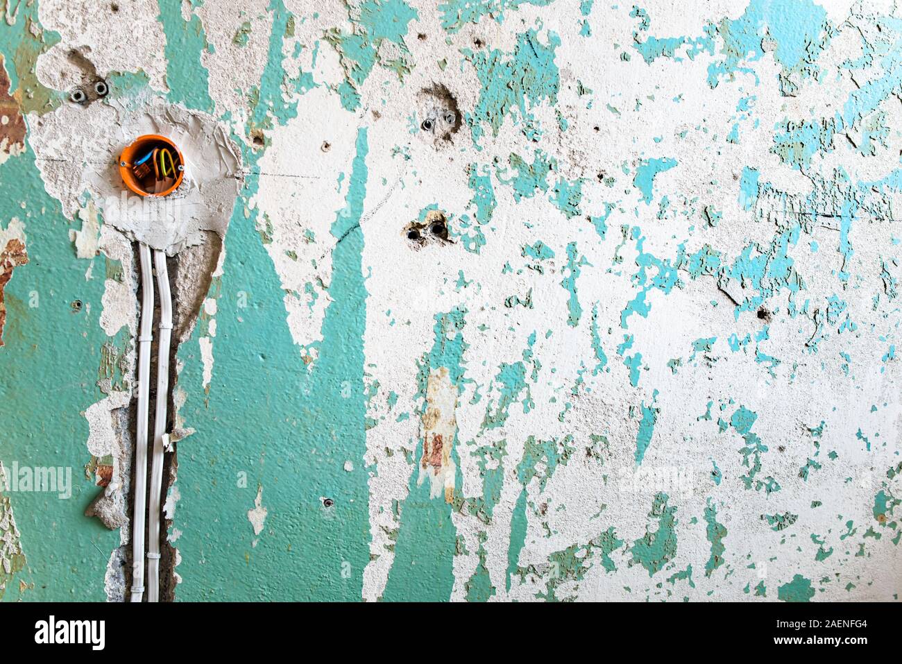 New electrical installation, socket and electrical cables on the wall ...