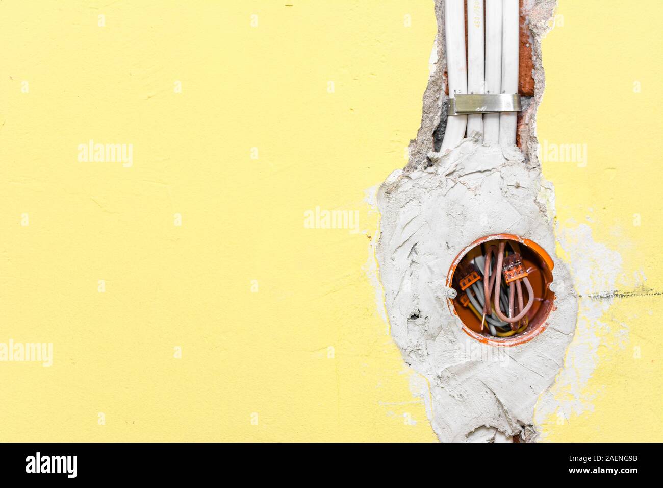 New electrical installation, socket and electrical wiring on the wall ...