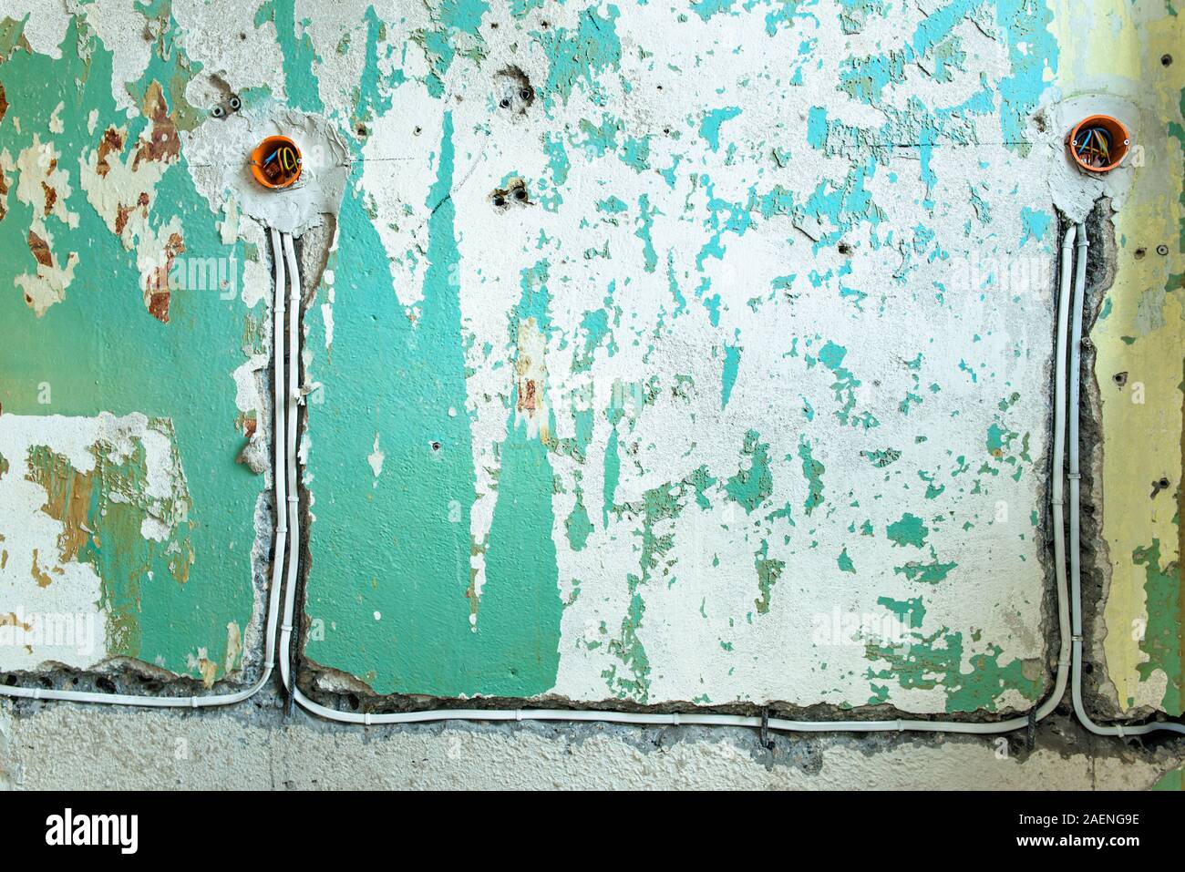 New electrical installation, socket and electrical wires on the wall ...