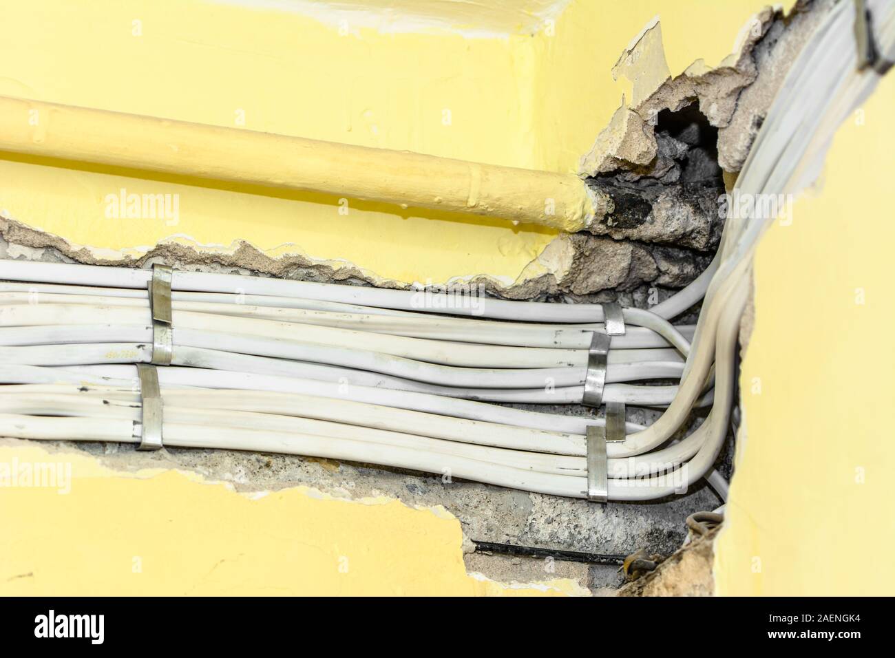 New electrical installation, socket and electrical wiring on the wall ...