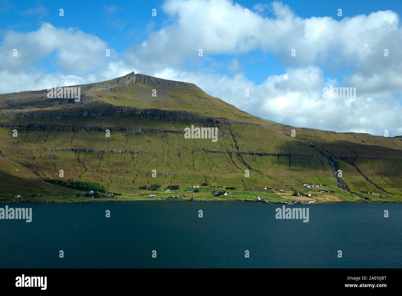 Landscape of Faroe Islands showing blue sky, green mountains and fjord ...