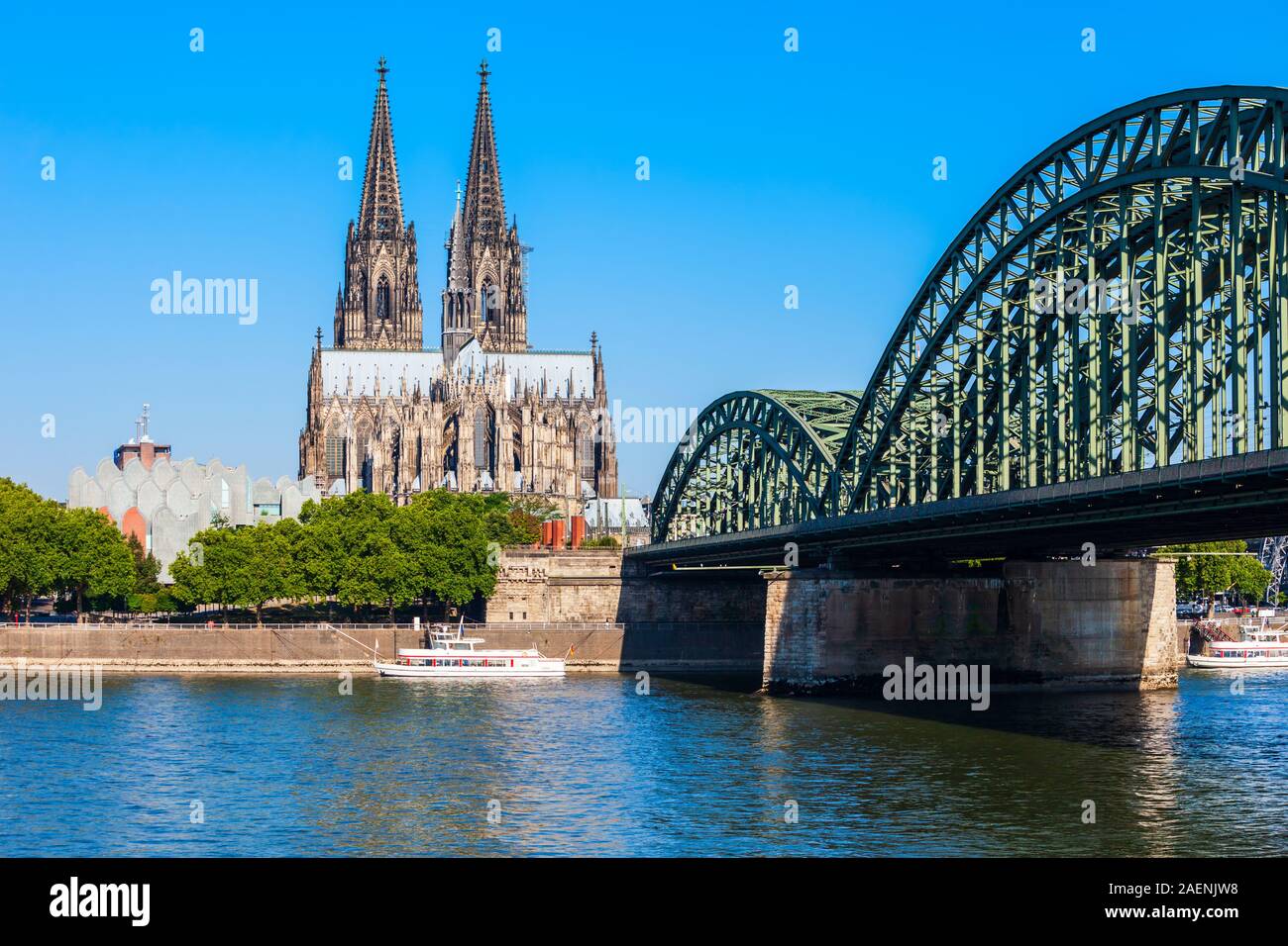 Cologne Cathedral and Hohenzollern Bridge through Rhine river in ...