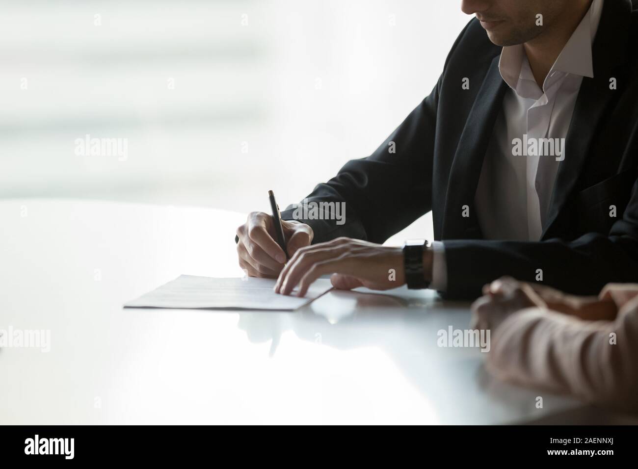 Close up confident businessman signing contract, partnership agreement ...