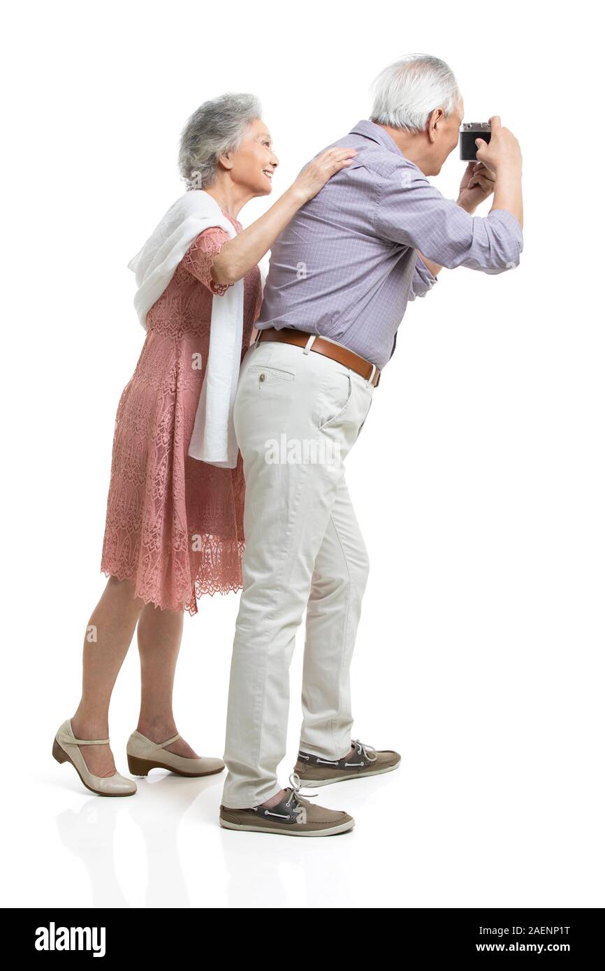 Senior photographer using digital hi-res stock photography and images ...