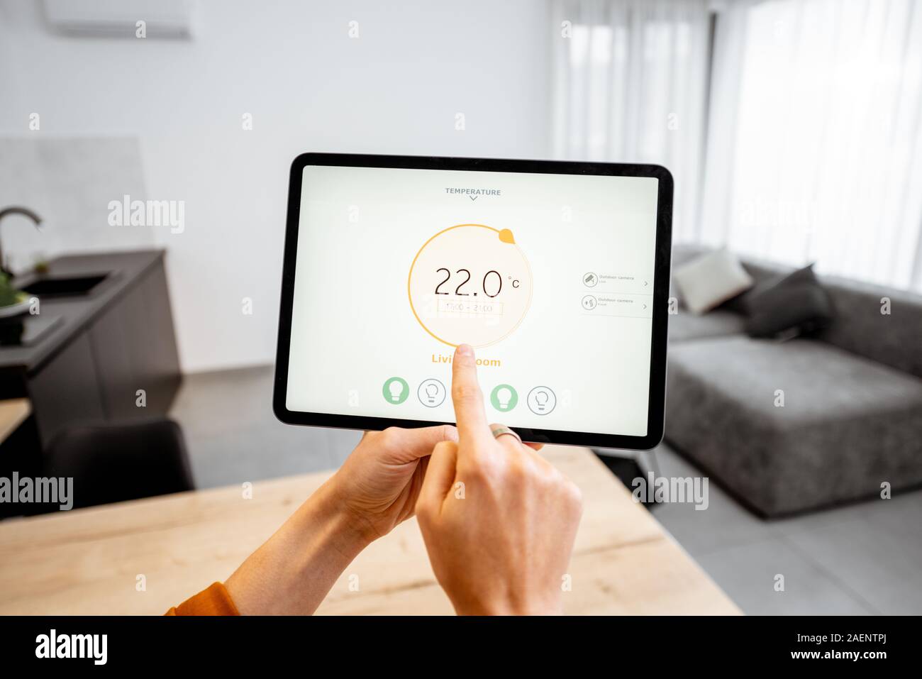 Controlling home heating temperature with a digital tablet. Concept of ...