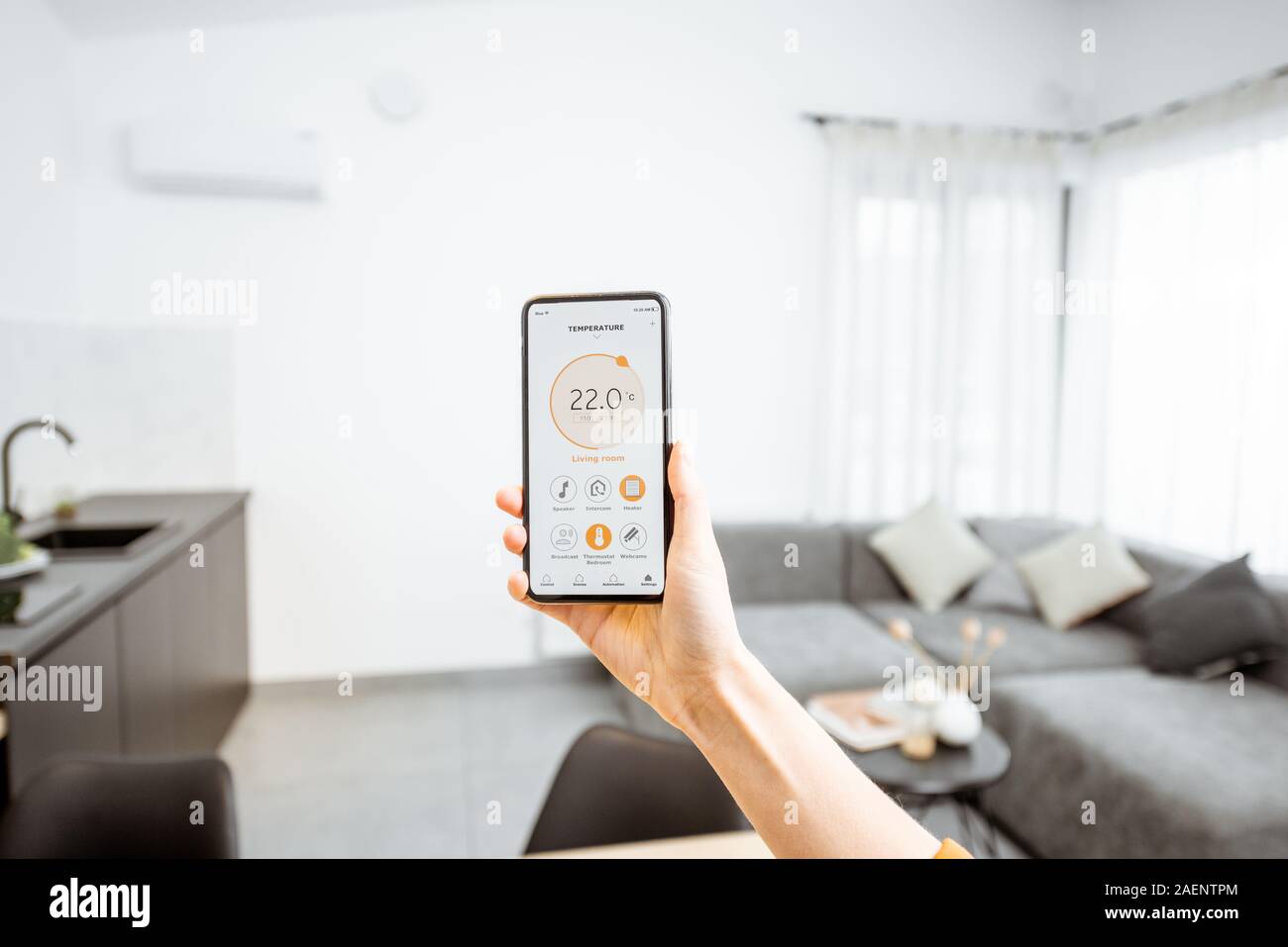 Controlling home heating temperature with a smart home, close-up on ...