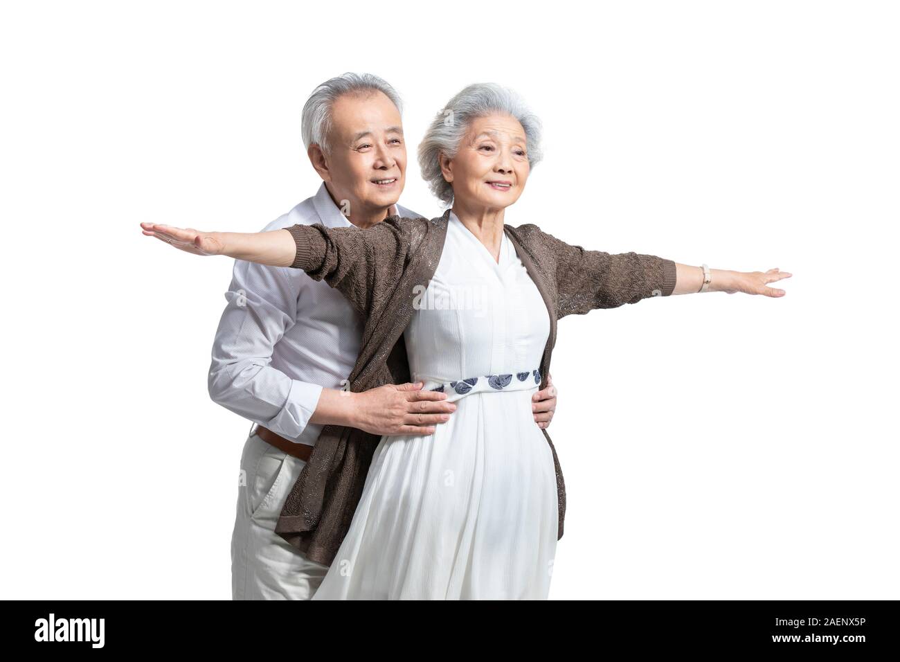 Senior couple embracing arms hi-res stock photography and images - Alamy