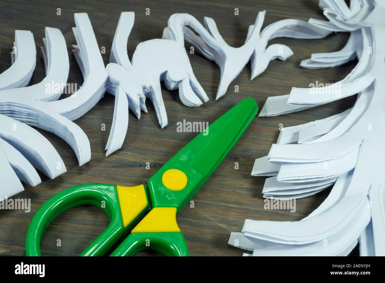 Scissors cut white snowflake ribbon hi-res stock photography and images ...