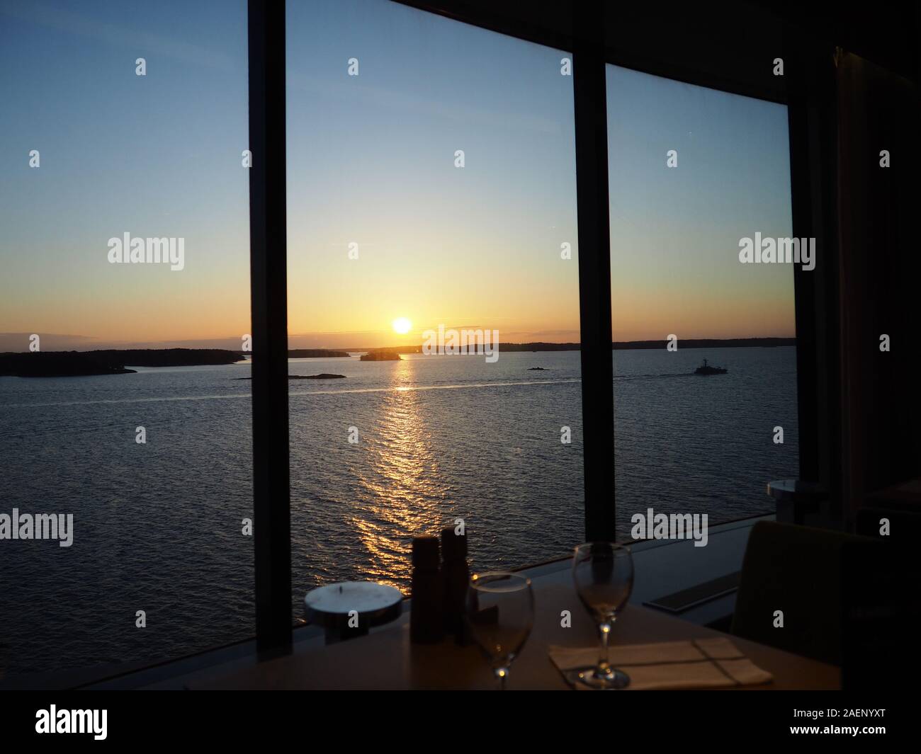 contrasting light, view through the large window of a cruise ship in a ...