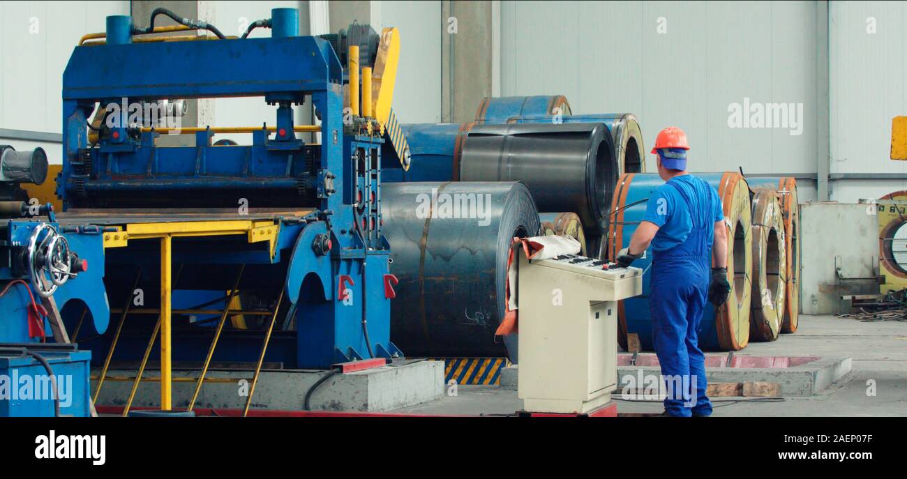 Engineer checking and controlling automatic machine in mechanical ... Engineer checking and controlling automatic machine in mechanical ...
