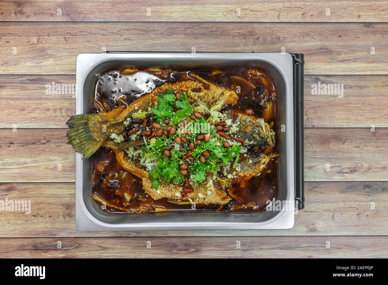 Flay lay view of Sichuan Grilled Fish in red spicy oil. Authentic China ...