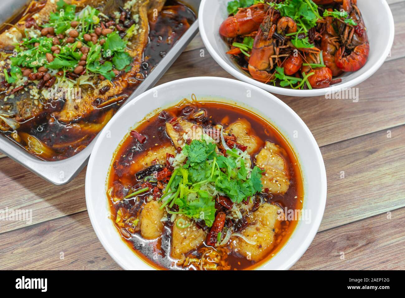 Assorted traditional dishes such, Spicy boiled fish, mini lobsters ...