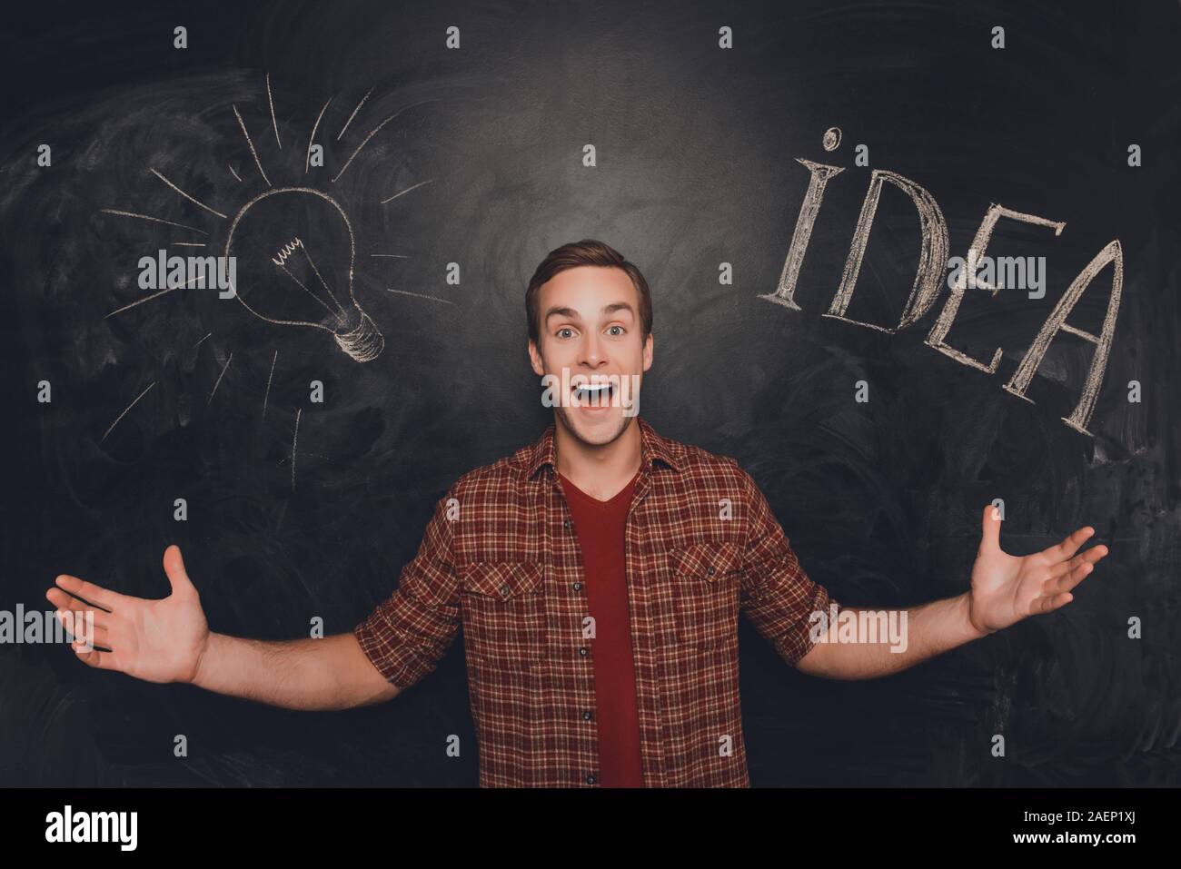 Happy cheerful young man finded way to solve his problem Stock Photo ...