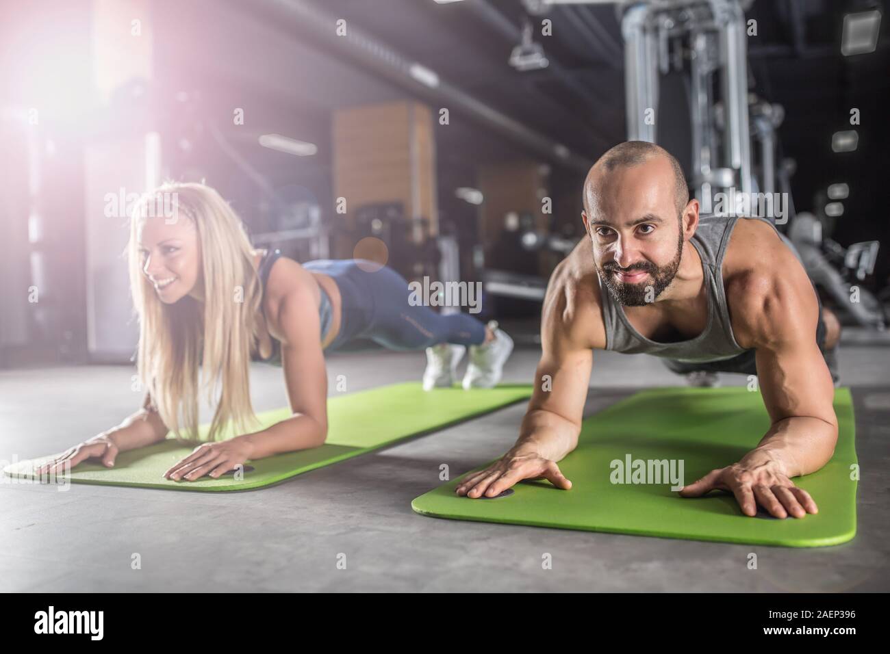 Sport Couple Doing Plank Exercise Workout In Fitness Centrum Man And