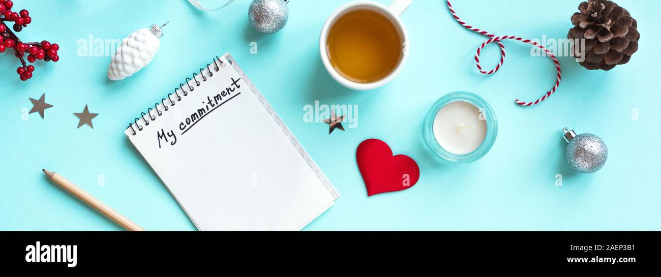 My Commitment written on paper with cup of tea, pencil and Christmas ...