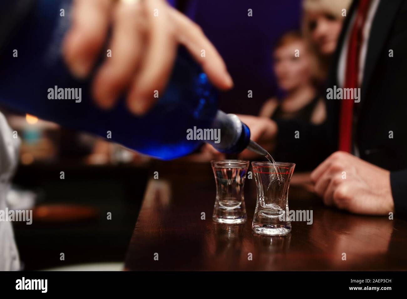 Pouring Shots Gif Bartender Pouring A Blue Liquid Into Shot Glasses On