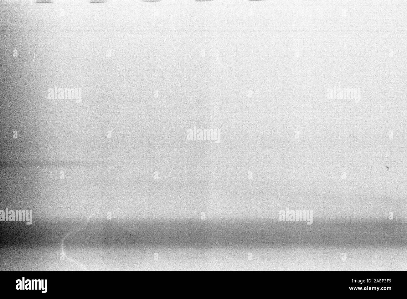 Overexposed noisy film frame with heavy noise, dust and grain. Abstract ...