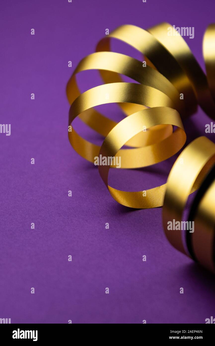 Curly gold ribbon satin hi-res stock photography and images - Alamy