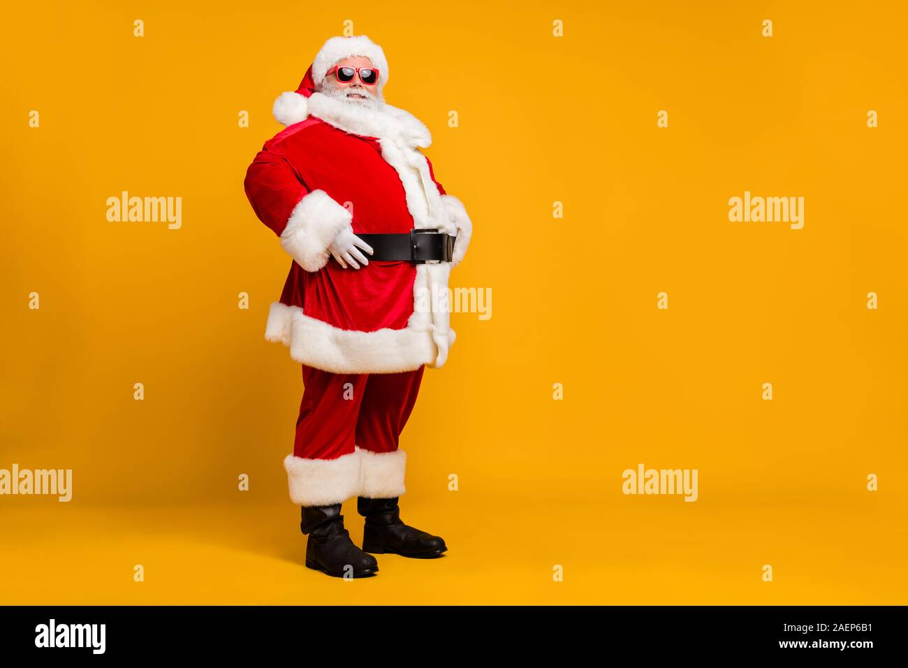 Full length profile side photo of funky fat santa claus in red costume ...