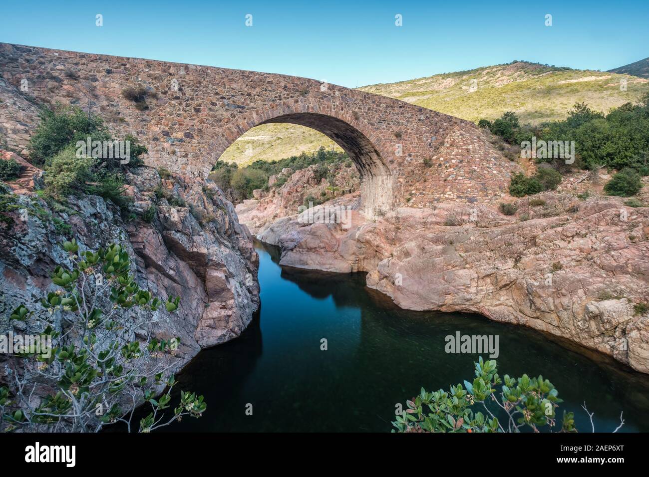 Stone arch of Ponte Vecchiu Genoise bridge over the Fango river in ...