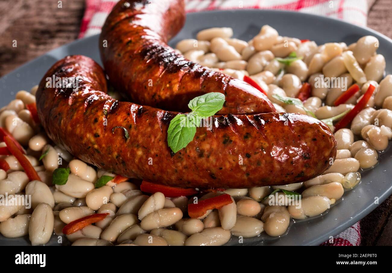 Beans with grilled sausage, traditional european homemade meal Stock ...