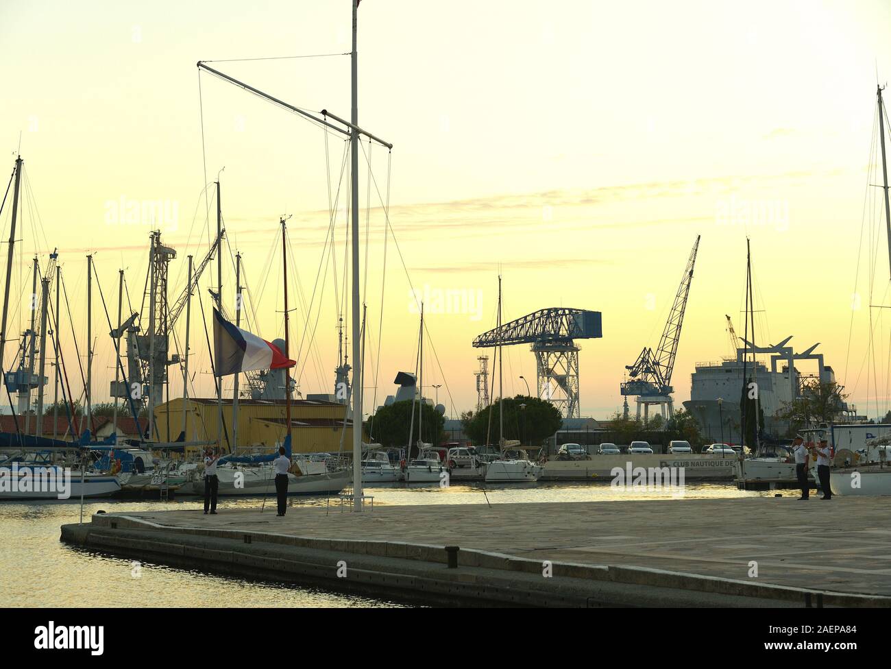 Descent of the national flag at sunset at the naval base of Toulon Var ...