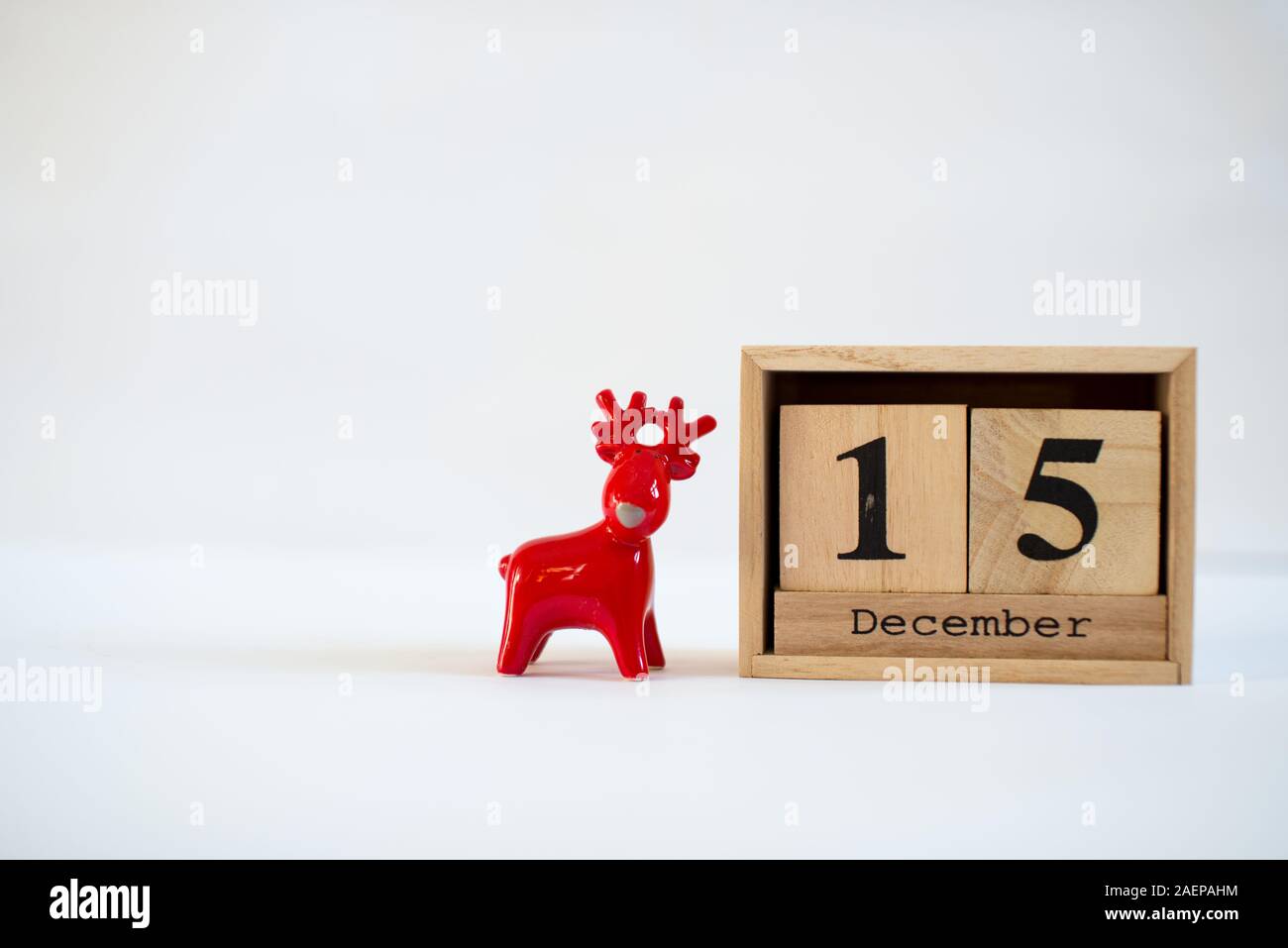 Cube wooden calendar showing date on 15th December with ceramic ...