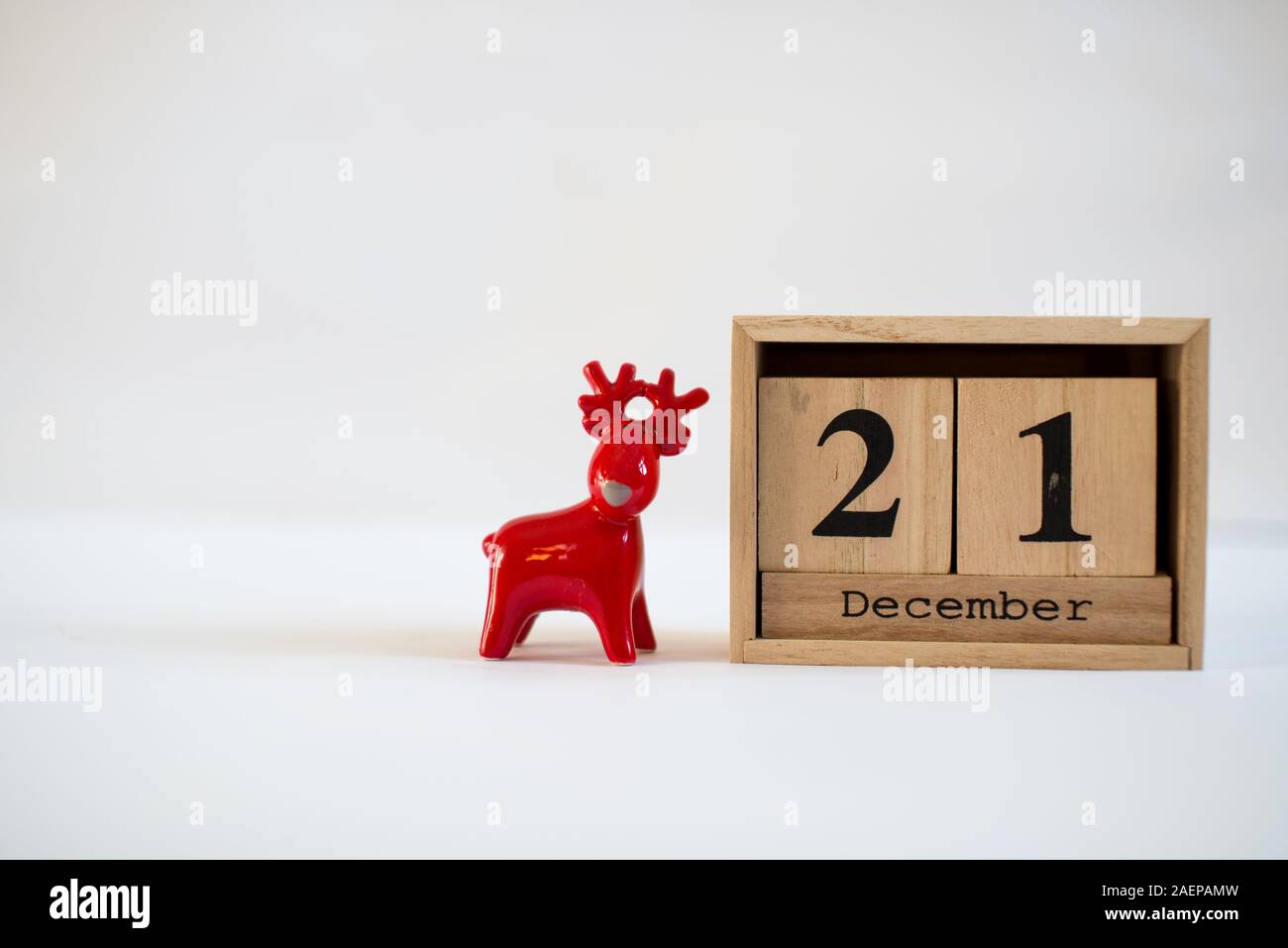 Cube wooden calendar showing date on 21th December with ceramic ...
