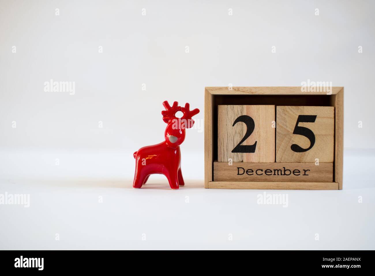 Cube wooden calendar showing date on 25th December with ceramic ...