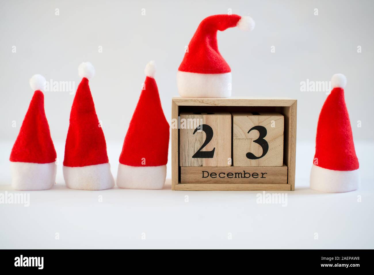 Cube wooden calendar showing date on 23th December with small Santa ...