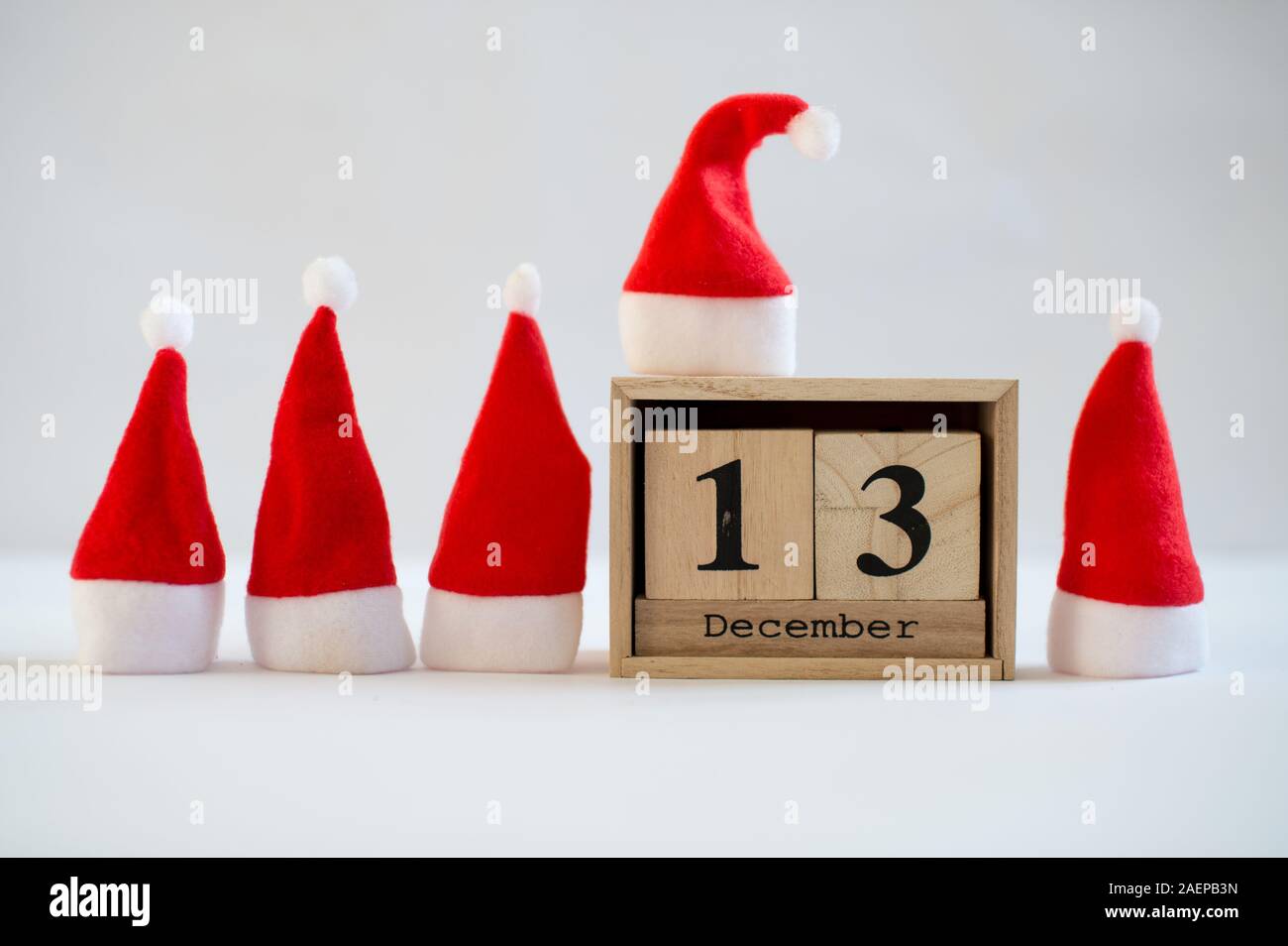 Cube wooden calendar showing date on 13th December with small Santa ...