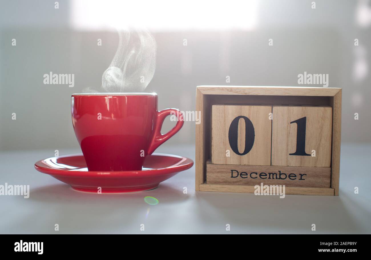 Cube wooden calendar showing date on 1th December with red cup of hot ...