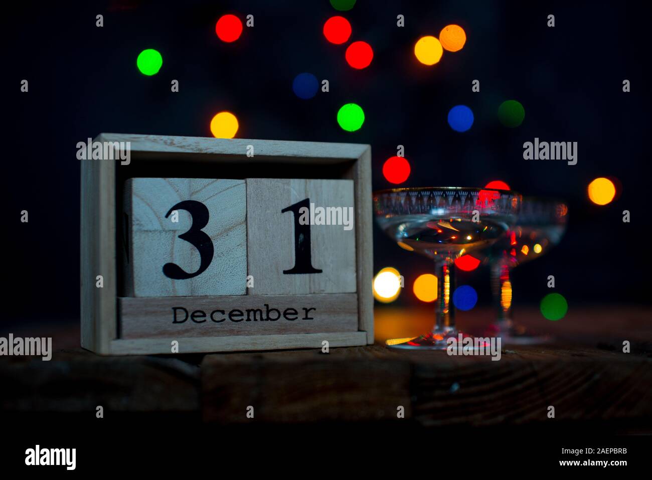 Cube wooden calendar showing date on 31th December over bokeh ...