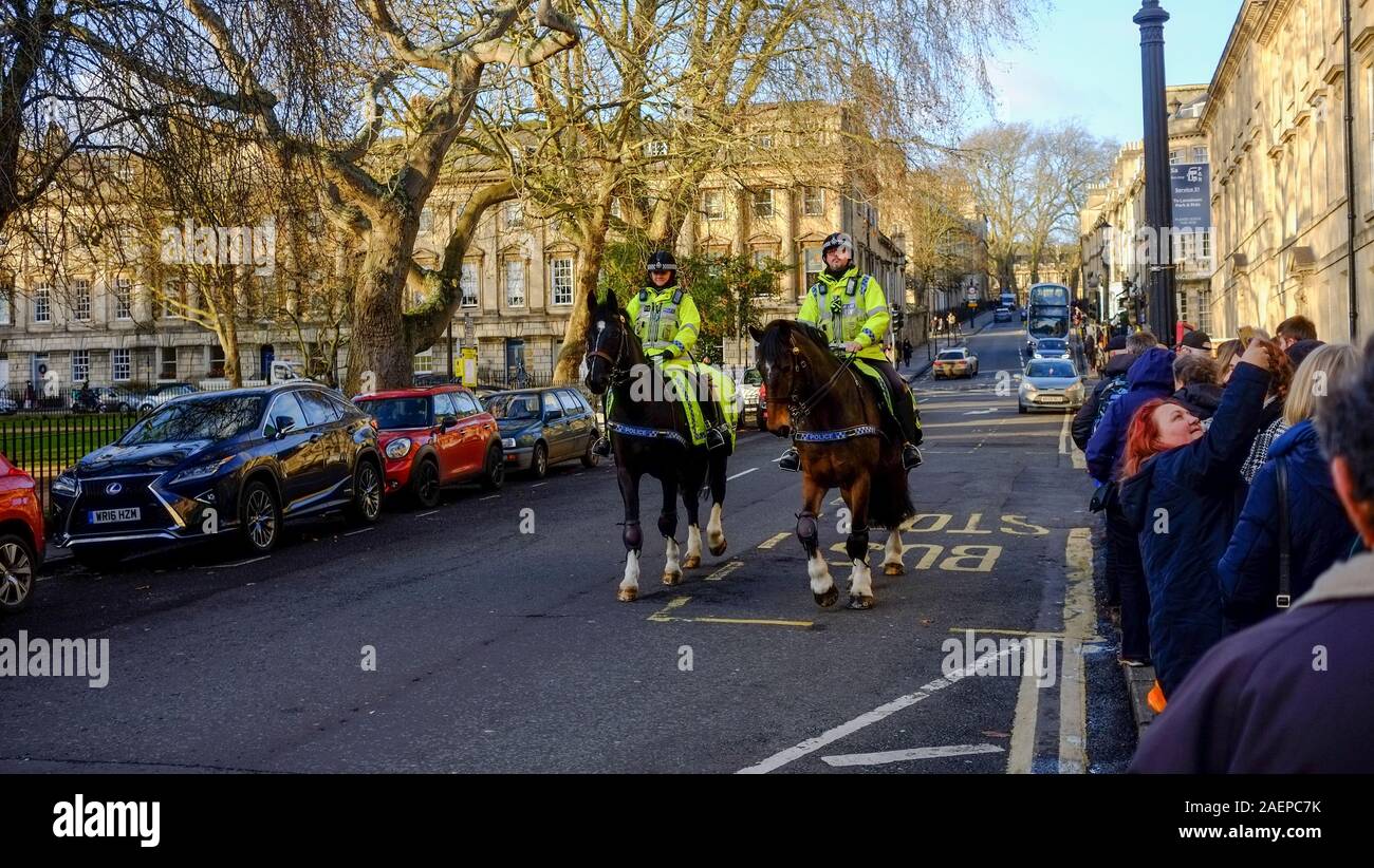 Mounted police officers make their way through Bath, Somerset, UK. Avon ...