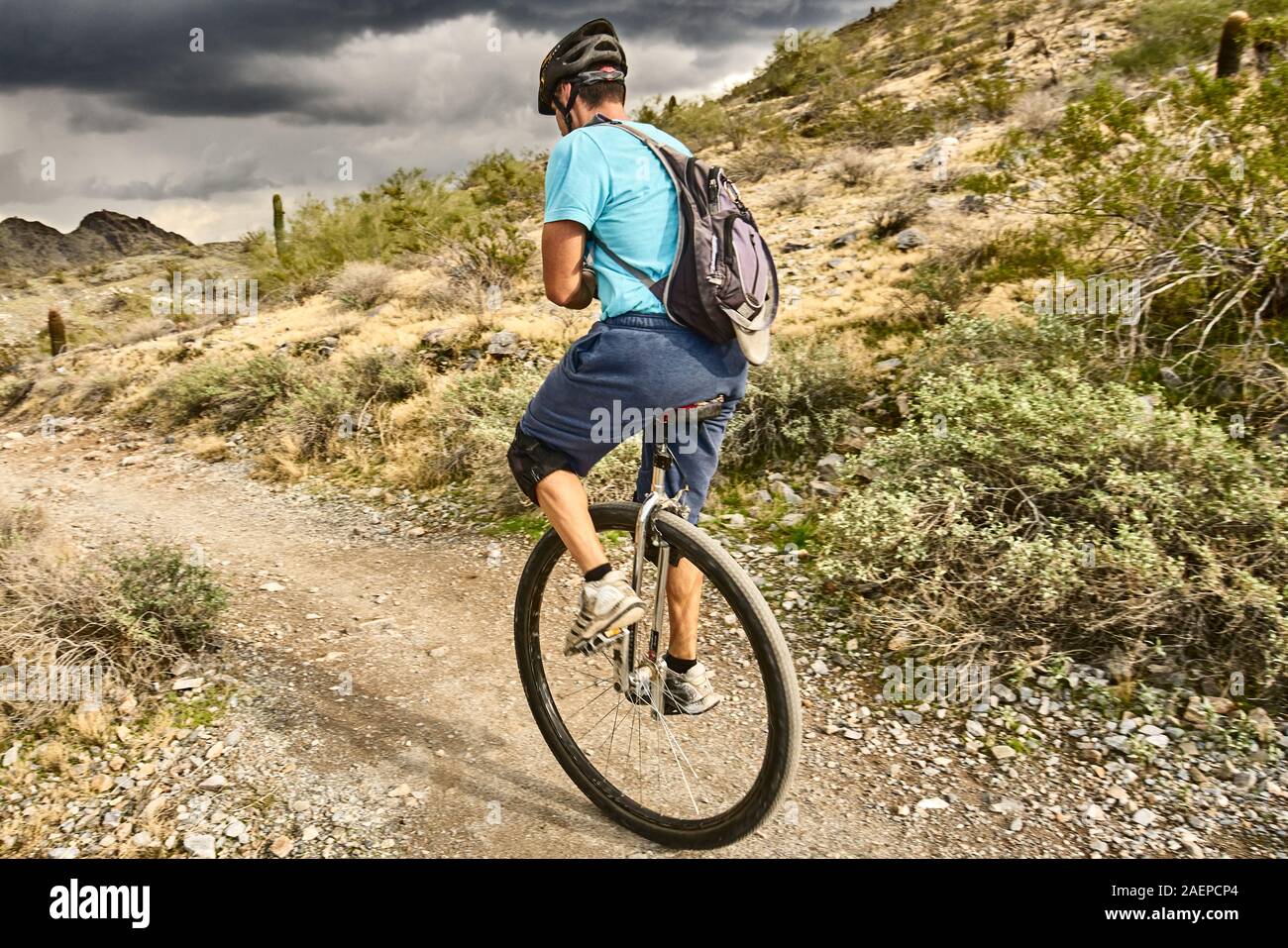 A man riding a unicycle in Phoenix Mountains Preserve. Phoenix. Arizona ...
