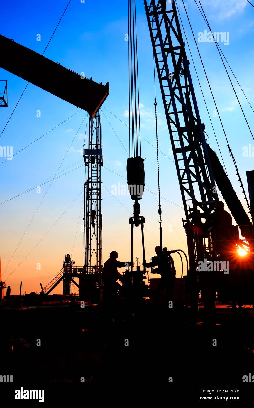 oil field, the oil workers are working Stock Photo - Alamy