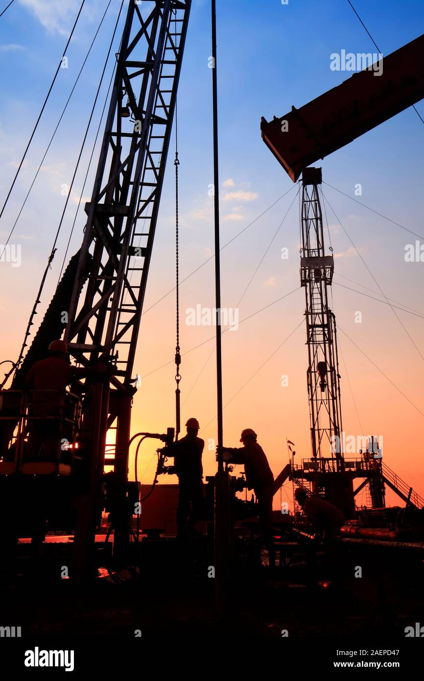 oil field, the oil workers are working Stock Photo - Alamy
