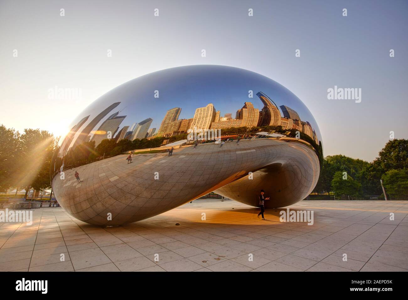 The sculpture Cloud Gate at sunrise, also known as the Bean, at ...