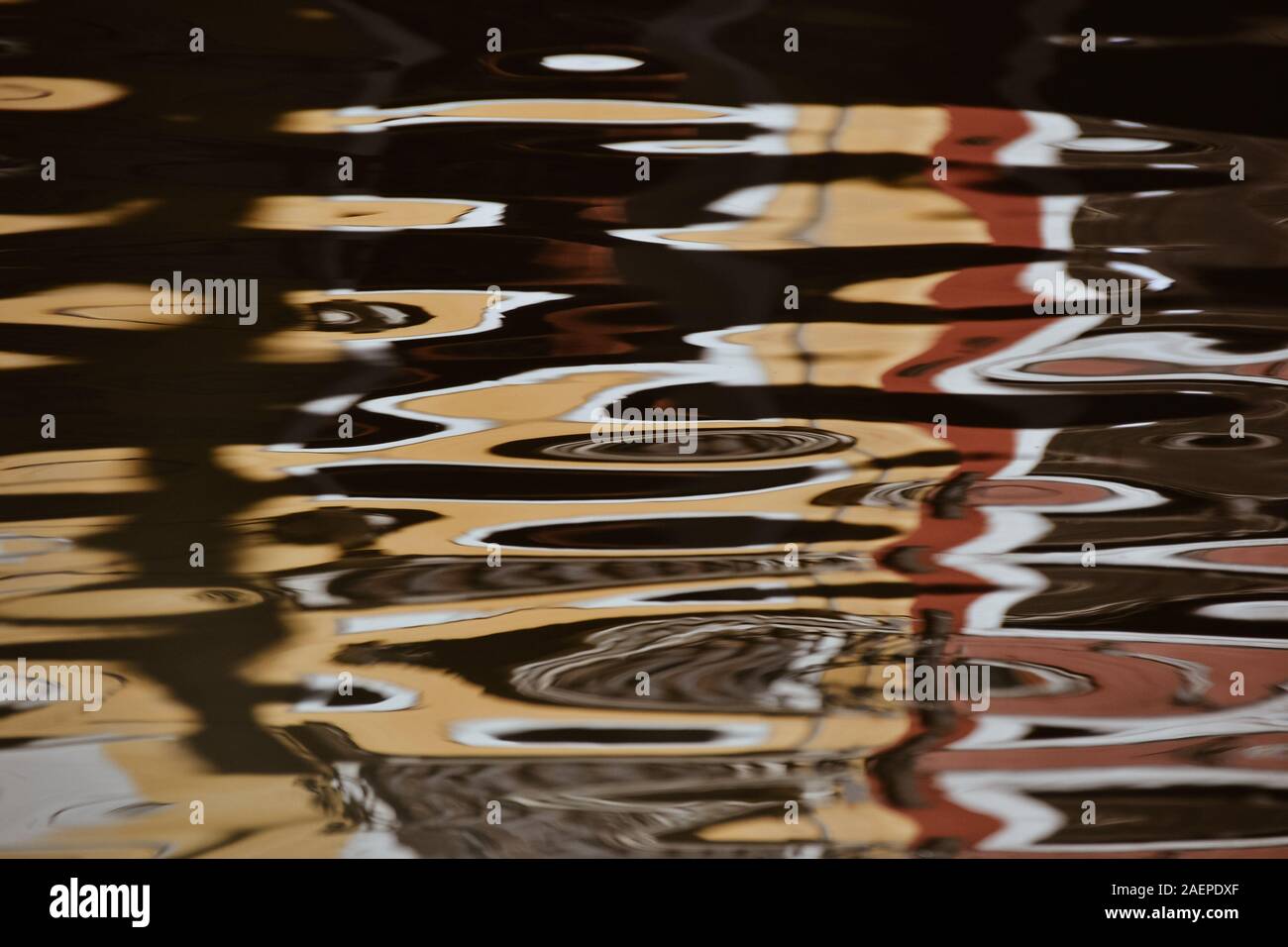 Orange and yellow reflection in the water of Venice Stock Photo - Alamy