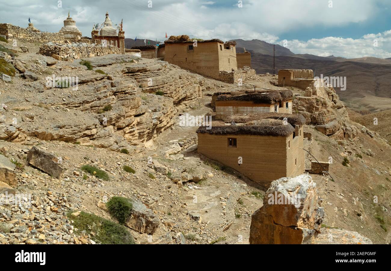 Isolated village of Tashigang with brick houses and Buddhist Stupas on ...