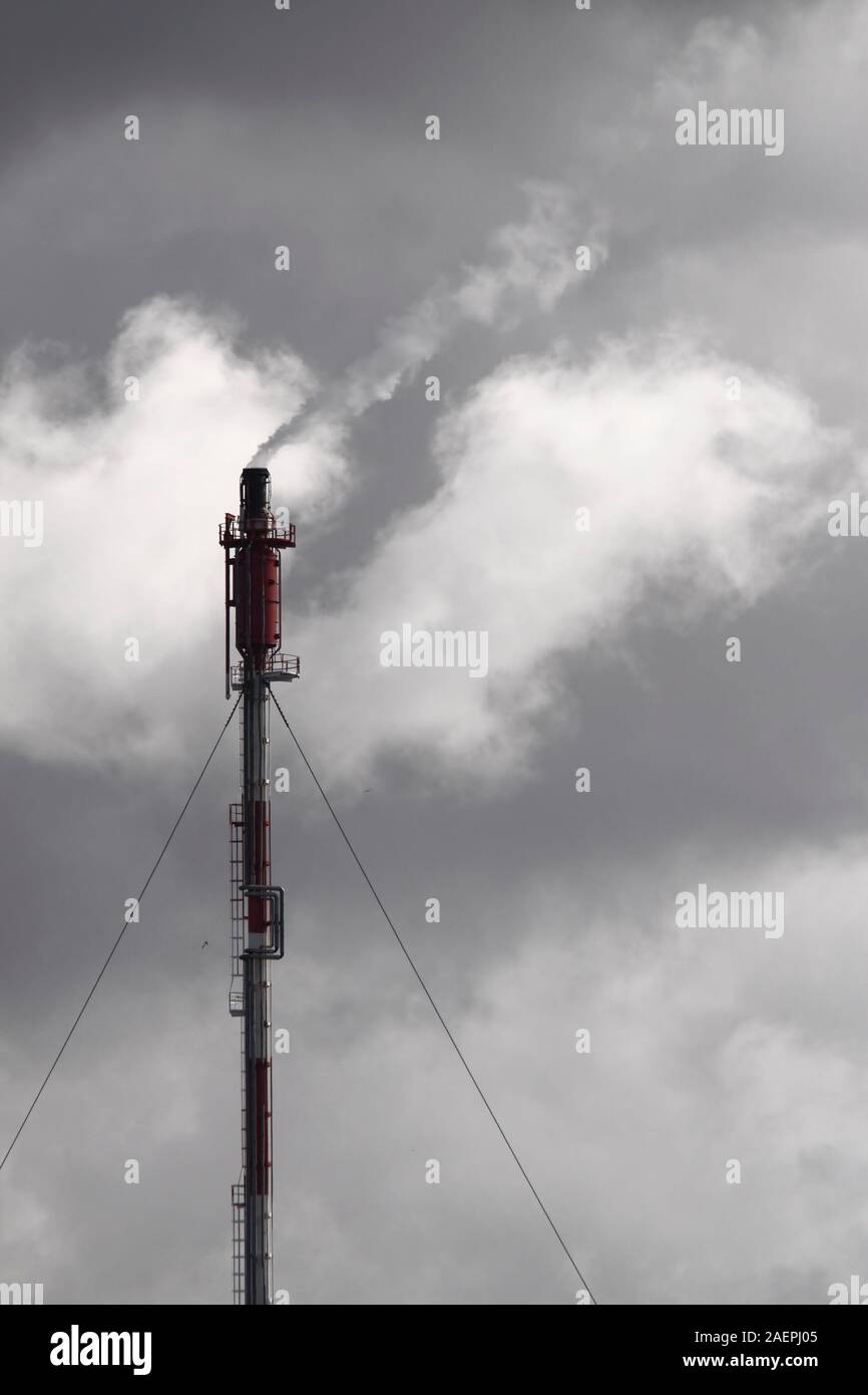 Oil refinery smokestack seeing smoke against dramatic cloudy sky Stock ...