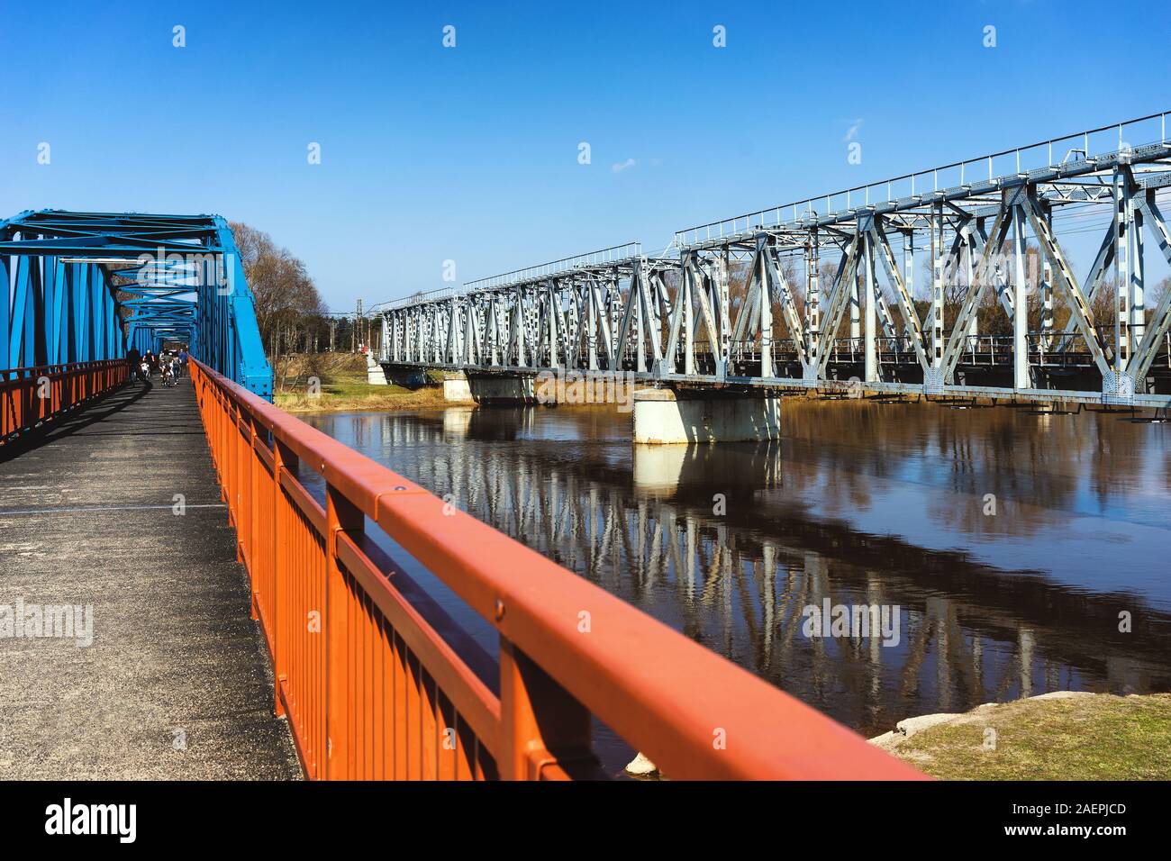 Pedestrian and railway bridges over the river Stock Photo - Alamy
