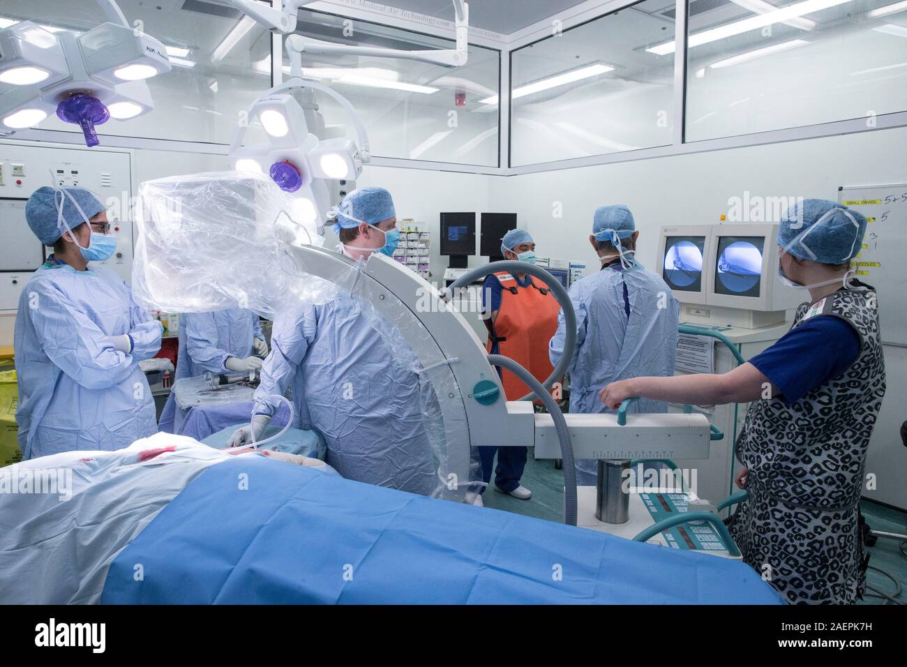 Surgeons at an NHS Hospital perform a knee operation, known as an ...