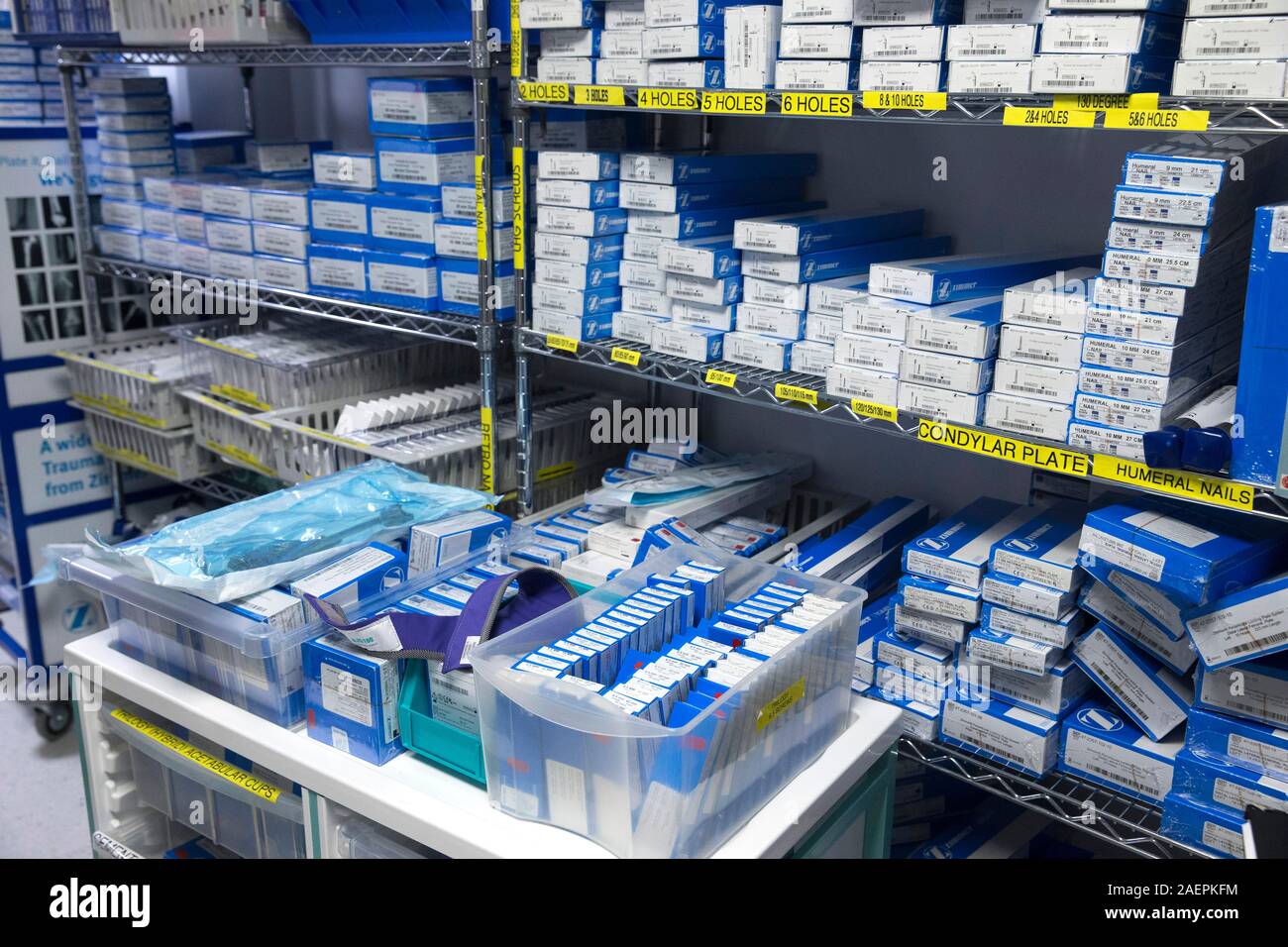 Equipment in a Hospital stockroom. Scrubs and medical equipment is kept ...