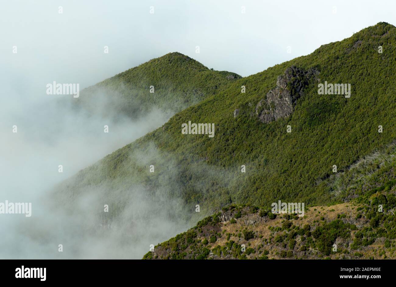 Two pyramid-shaped mountains on Madeira Island, Portugal surrounded by ...