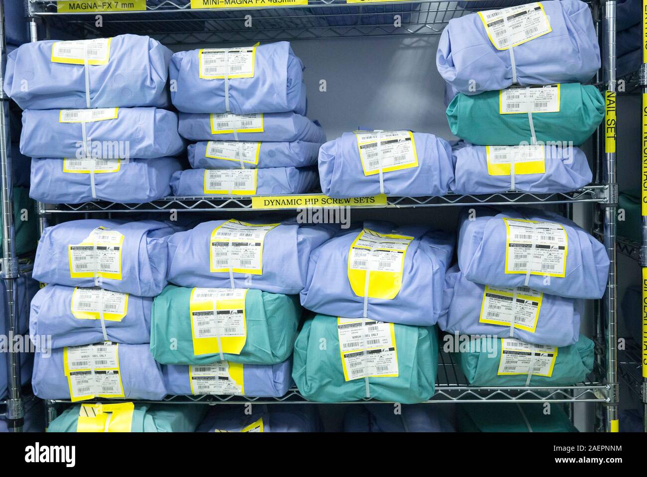 Close-Up of NHS Hospital stockroom showing packs of New Hospital scrubs ...