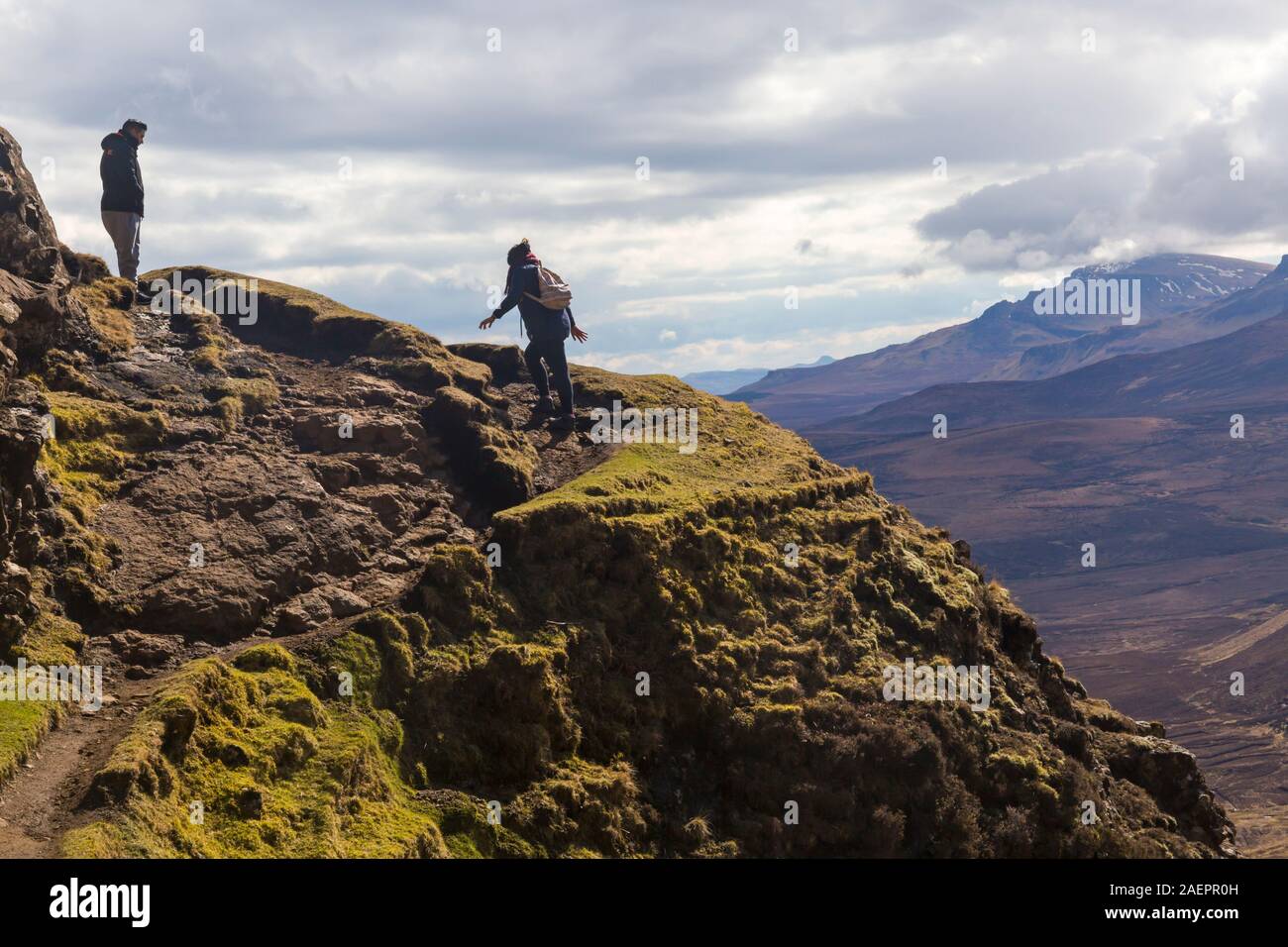 Walkers walking up the Quiraing, Isle of Skye, Scotland, UK in March ...