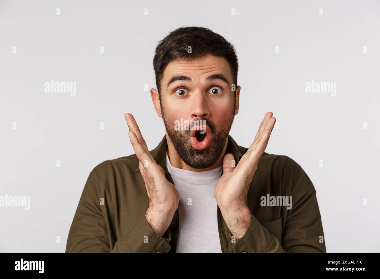 Excited, amused and surprised adult man hear favorite band coming in ...