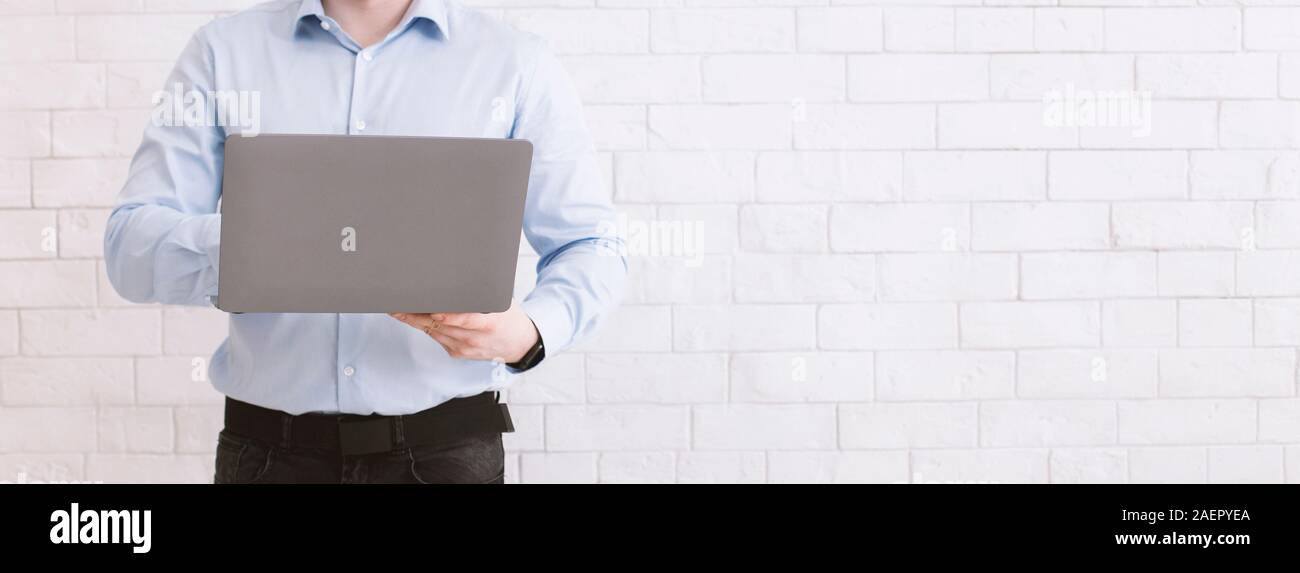 Employee using modern laptop at work, empty space Stock Photo - Alamy